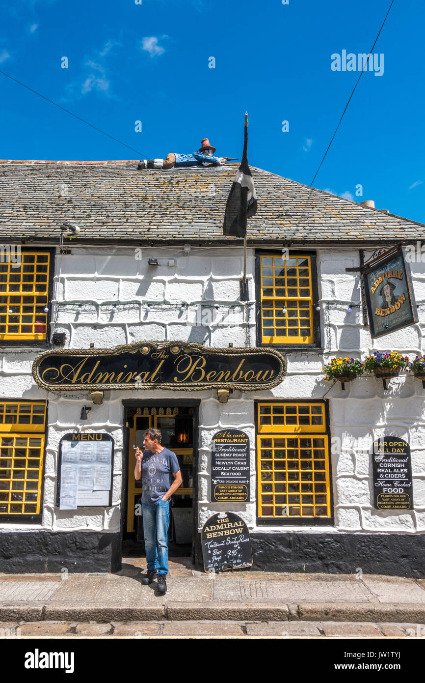 Man having a smoke outside the Admiral Benbow pub in Penzance, Cornwall ...