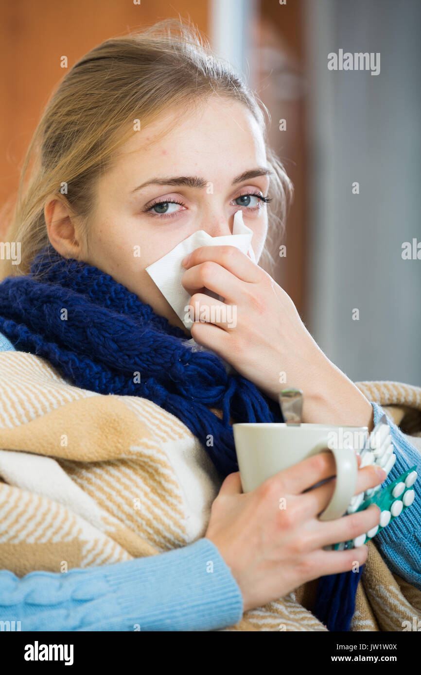 Portrait of girl suffering of cold and having stuffy nose Stock Photo ...