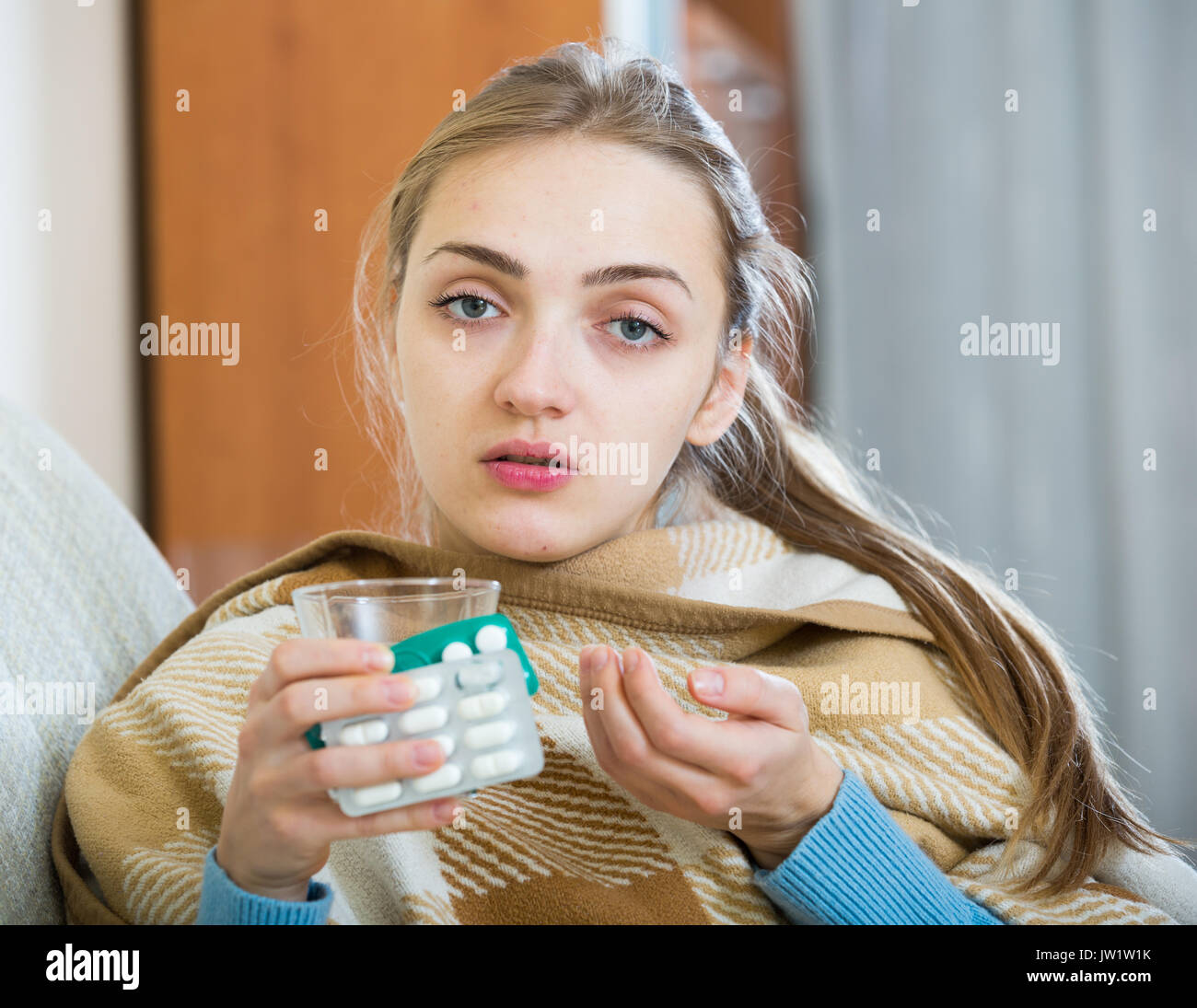 Portrait of female with quinsy and fever under blanket Stock Photo - Alamy