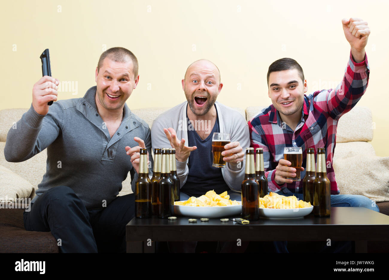 Interior three men sit hi-res stock photography and images - Alamy