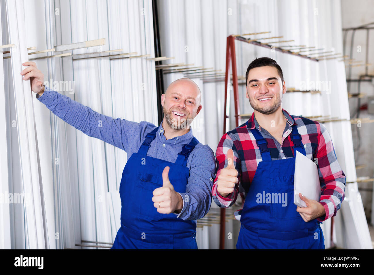 Factory workers operating pvc frame hi-res stock photography and images ...