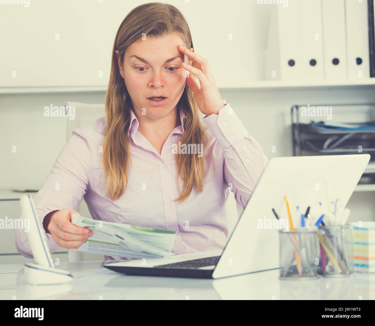 Young woman worker facing challenge in project in office Stock Photo ...
