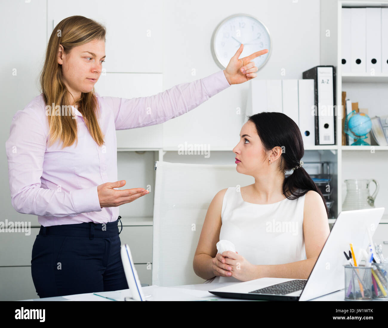 Conflict in office between female senior manager and woman worker Stock ...