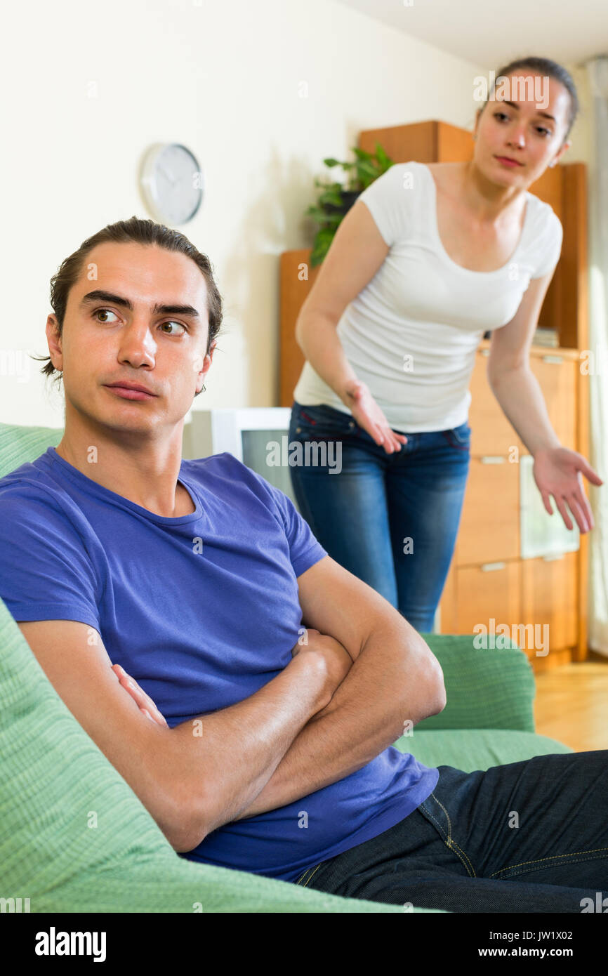 Ordinary young family having conflict at home Stock Photo - Alamy