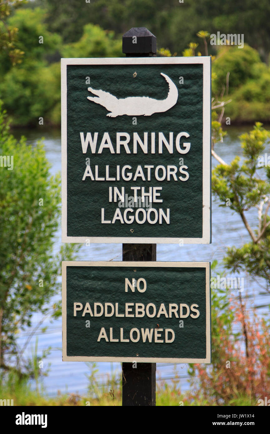 Warning Alligators in the lagoon sign Stock Photo - Alamy