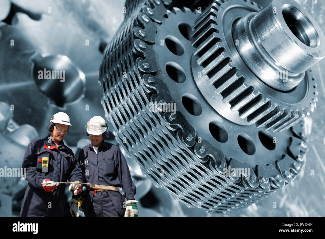 two industry workers with giant cogs machinery in background Stock ...