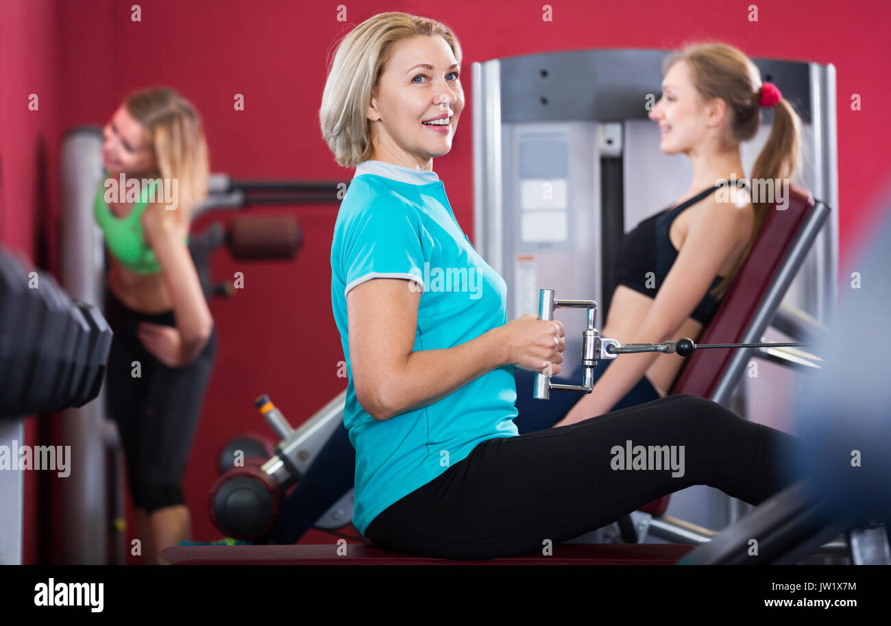 Women on exercise machines hi-res stock photography and images - Alamy