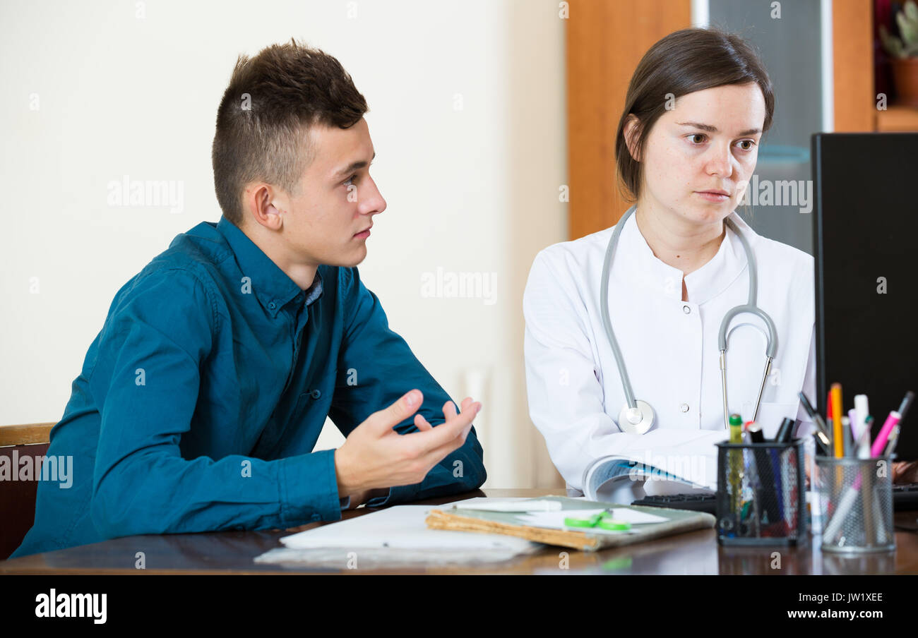 Teen boy doctor consultation clinic hi-res stock photography and images ...