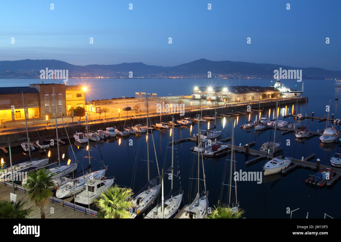 seascape of the port of Vigo city ant sunset with the vessels and ...