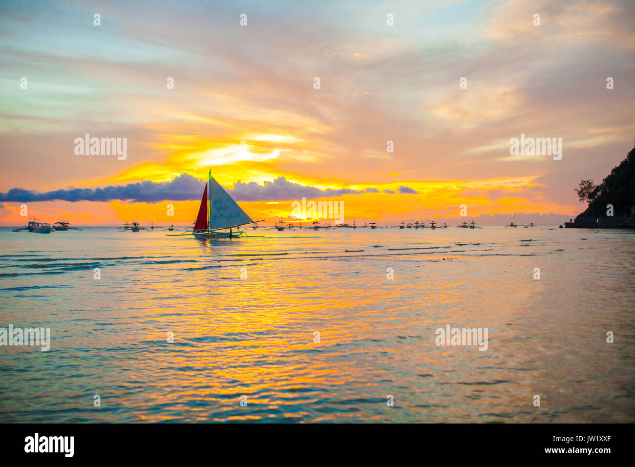Sailing boat to the sunset in Boracay island on Philippines Stock Photo - Alamy