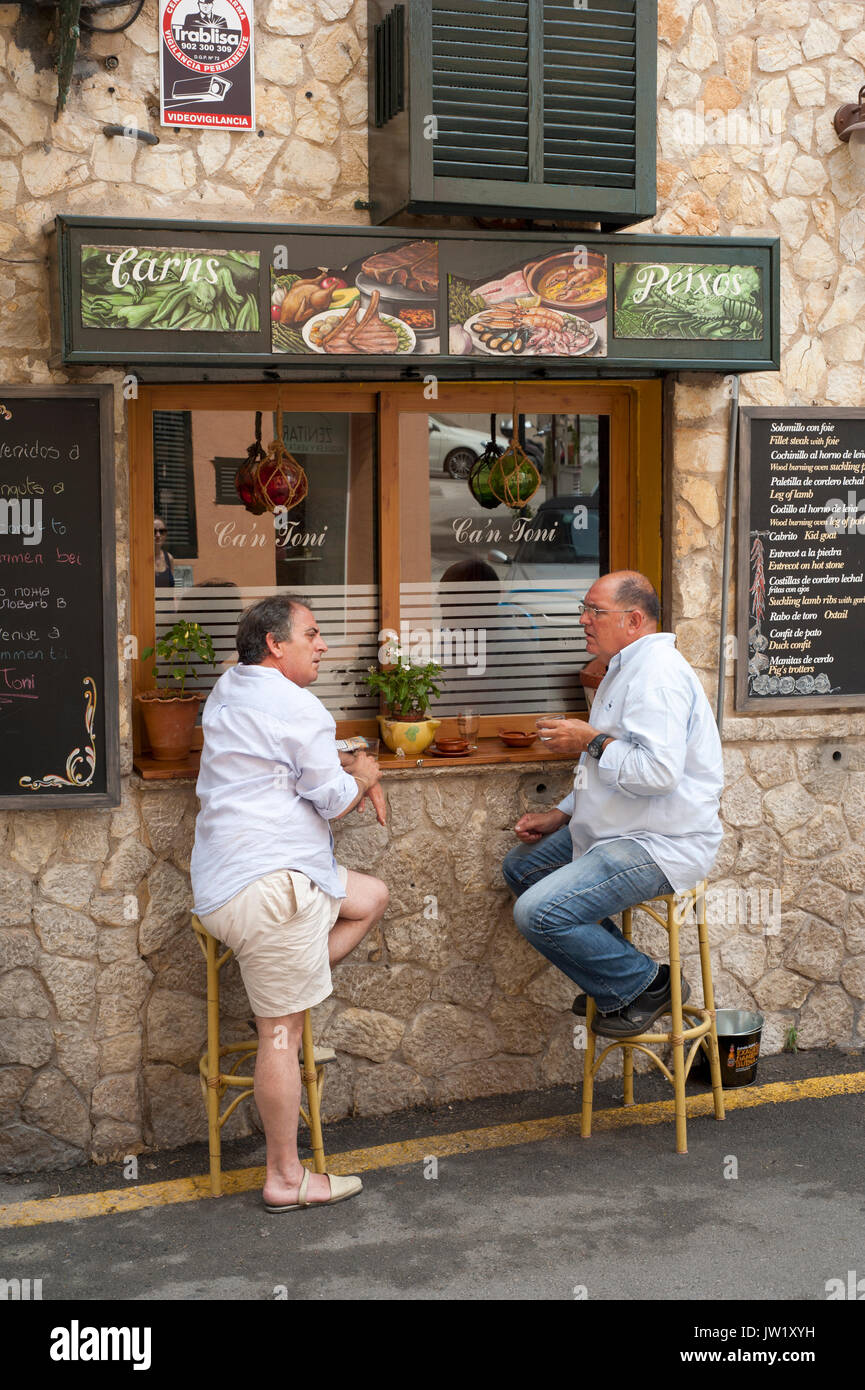 Two men talking outside a cafe, Mallorca De Palma, Majorca, Spain Stock ...