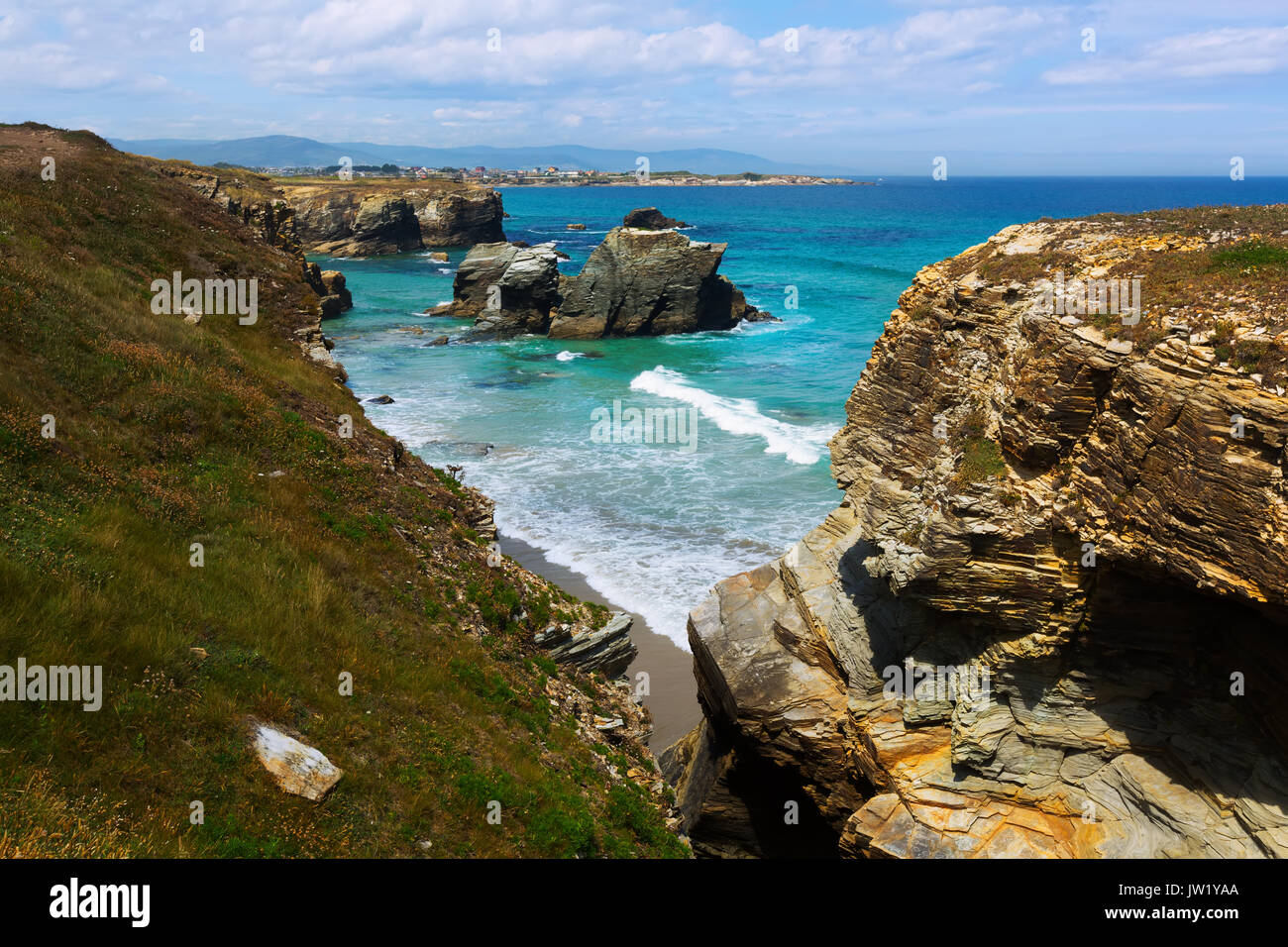 Rocks at beach in summer day. Cantabric coast Stock Photo - Alamy