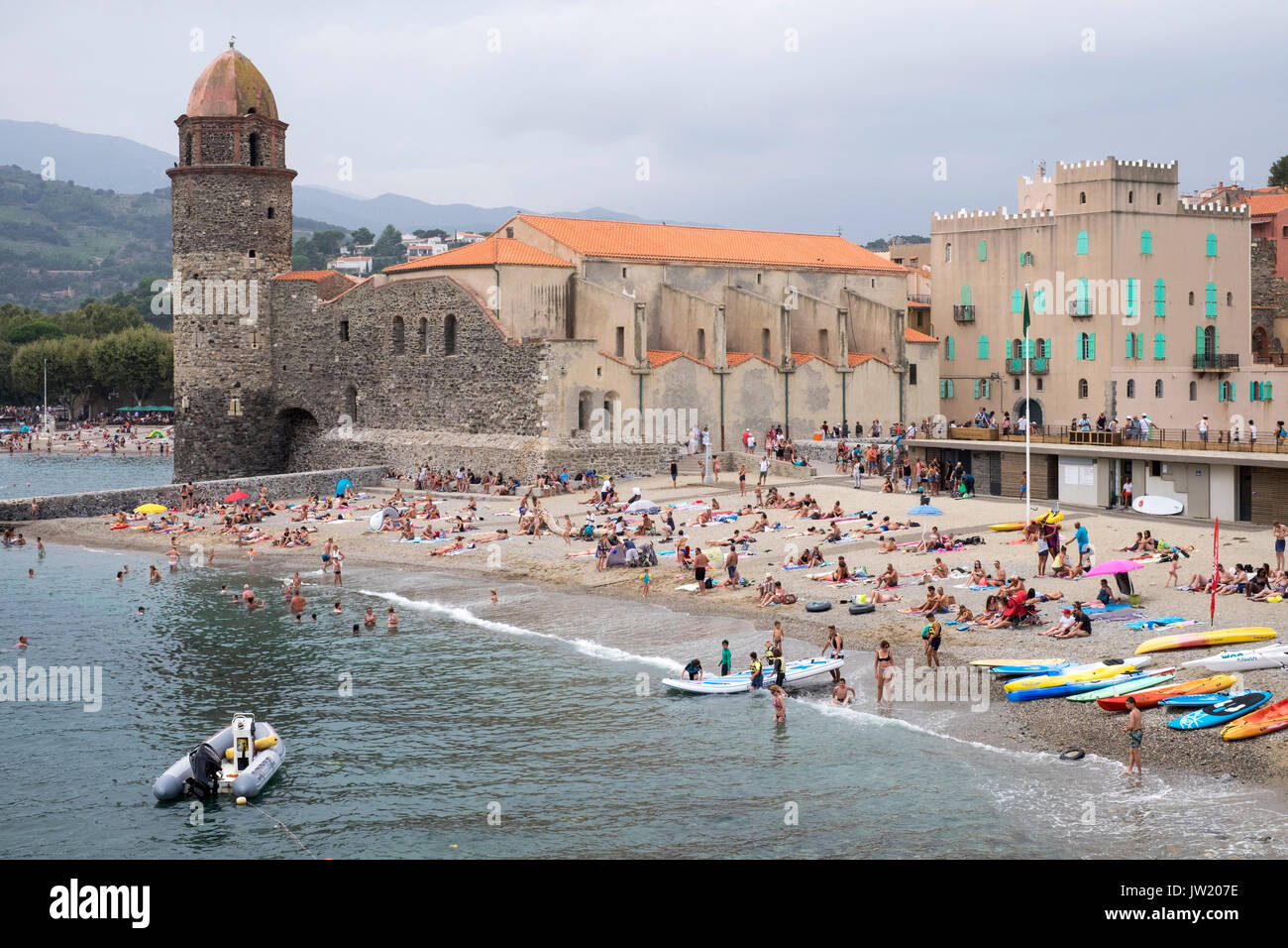 The seafront at Collioure, Spain, with its pretty harbour and beach ...