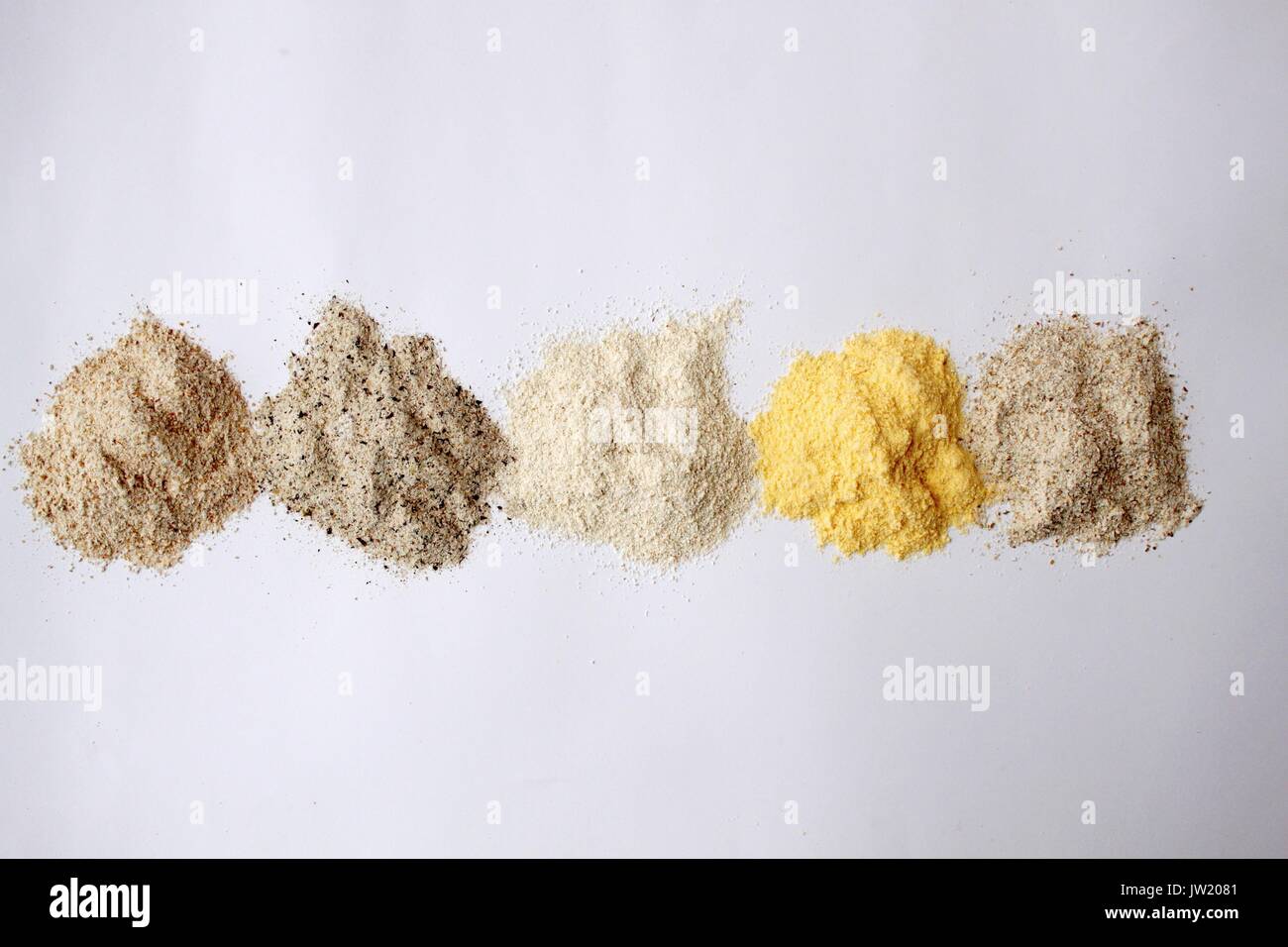 Five different types of flour on white background Stock Photo - Alamy