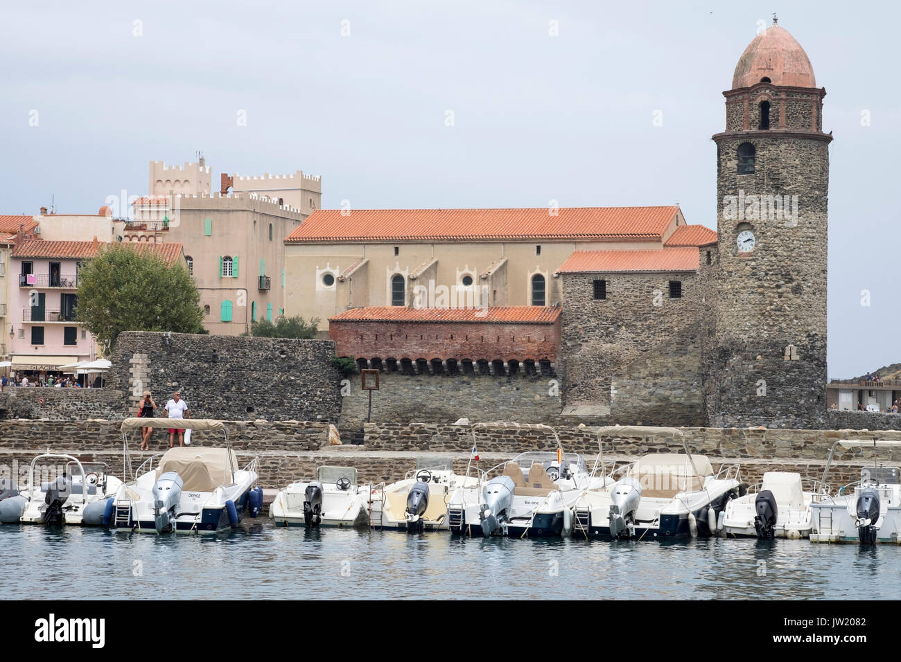 The seafront at Collioure, Spain, with its pretty harbour and beach ...