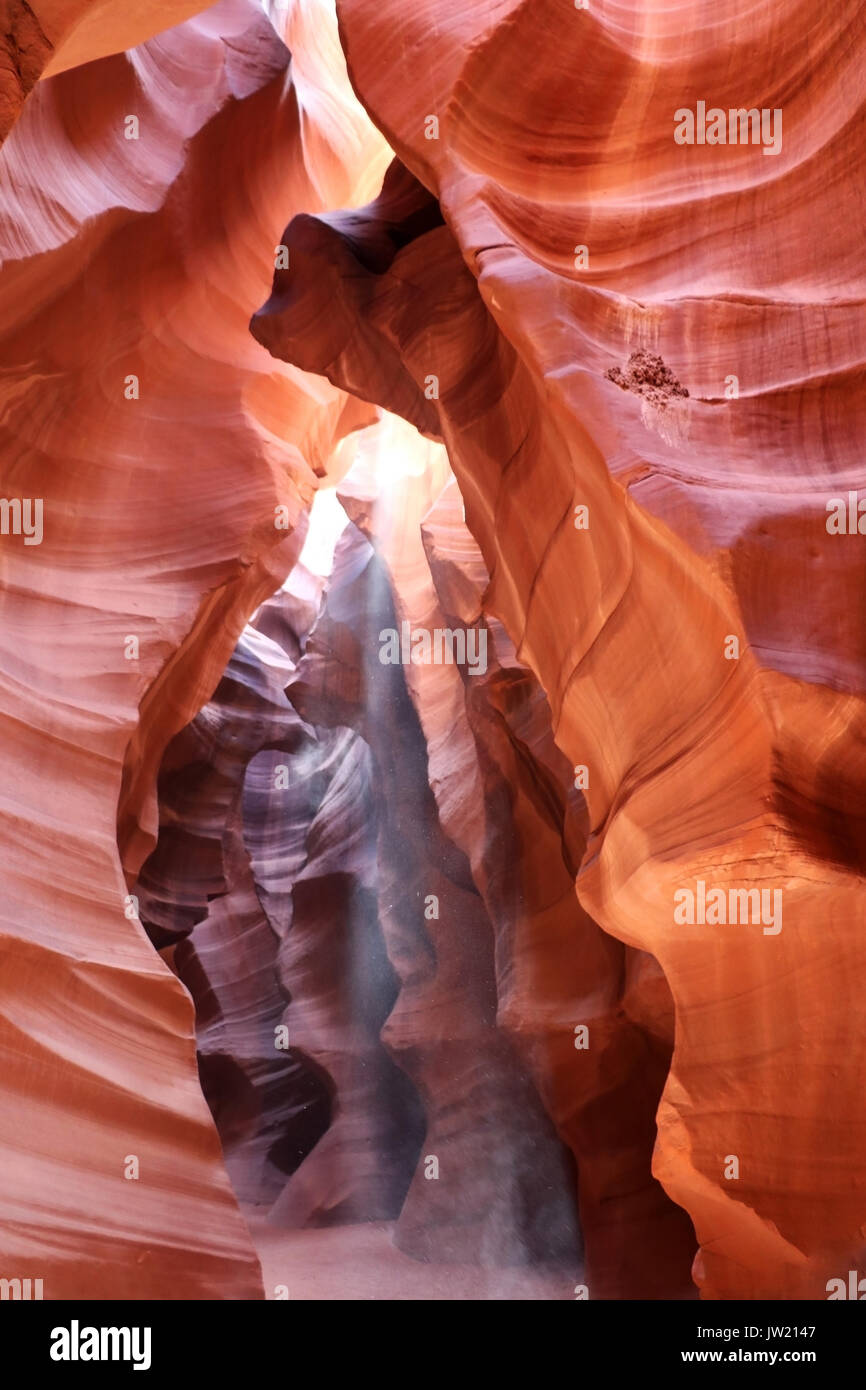 Rays of light illuminating red sandstone cave in the Upper Antelope ...