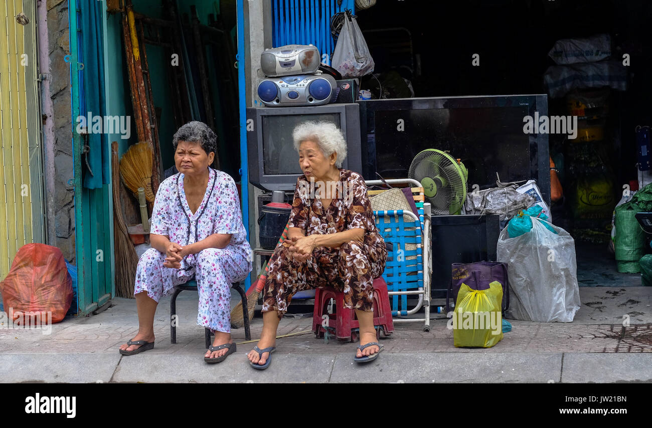 Vietnamese Women talking in the street in Ho Chi Minh City, Vietnam ...