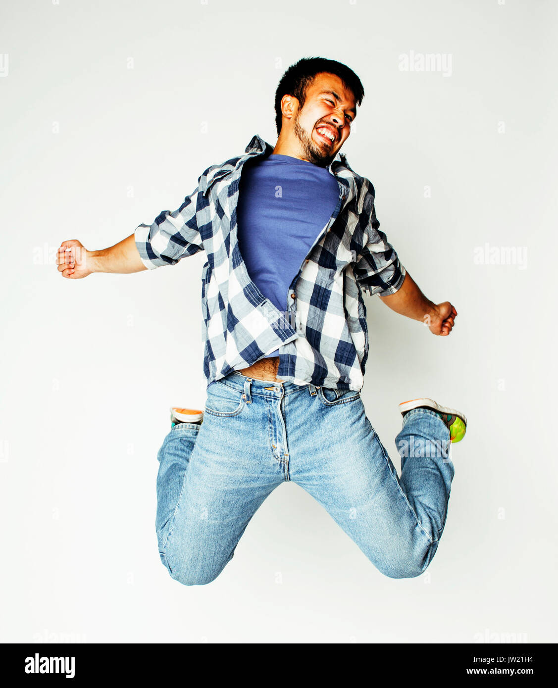 young pretty asian man jumping cheerful against white background Stock ...