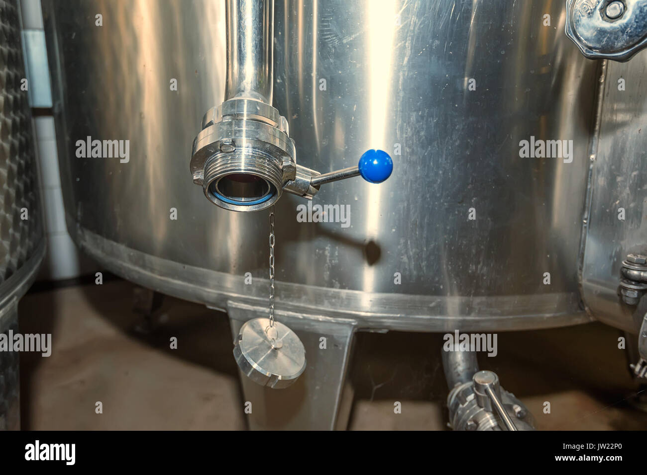 Wine tank discharge Stock Photo - Alamy