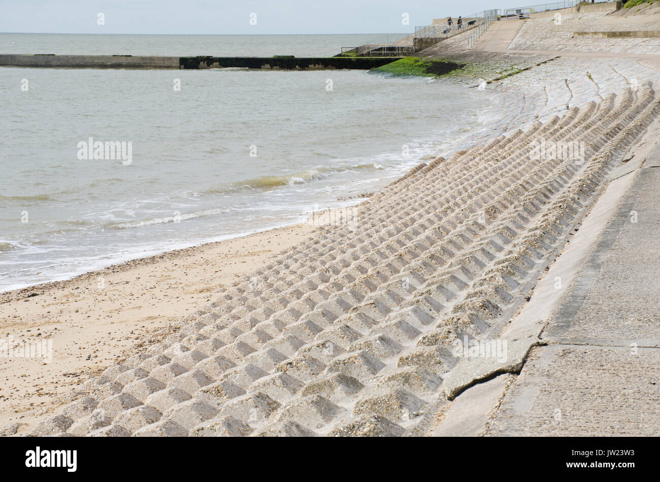Coastal protection blocks with sea in background Stock Photo - Alamy