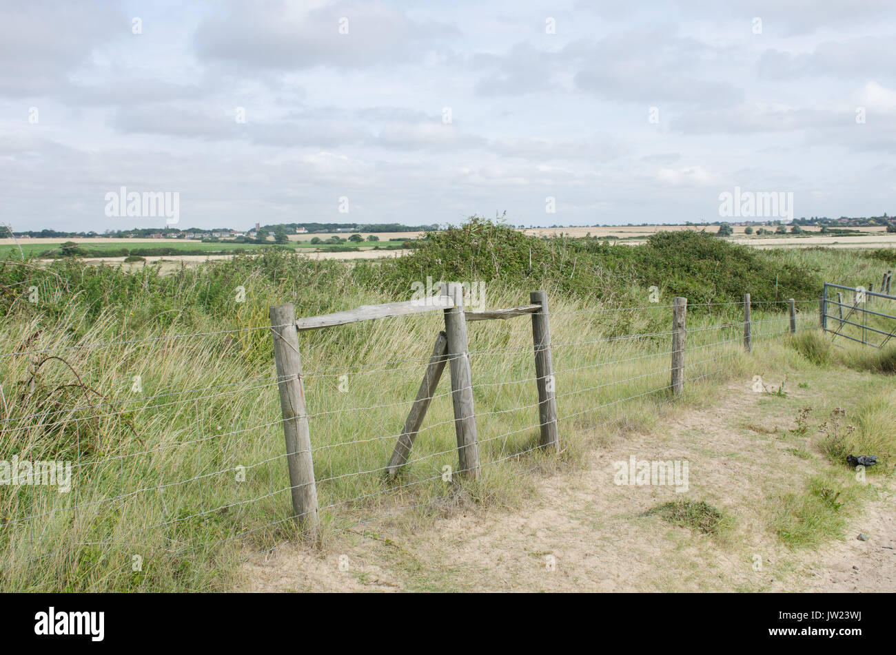 Wooden structure on flat land with fields behind Stock Photo - Alamy