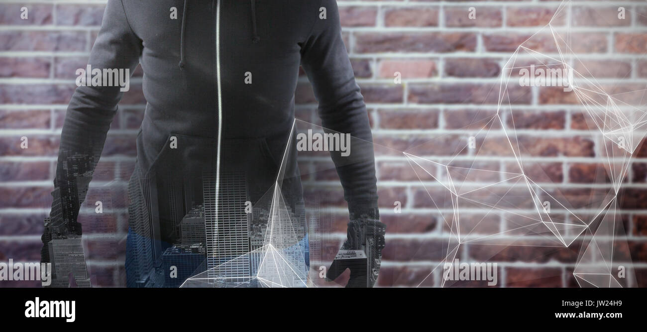 Robber wearing black hoodie against abstract black background Stock ...