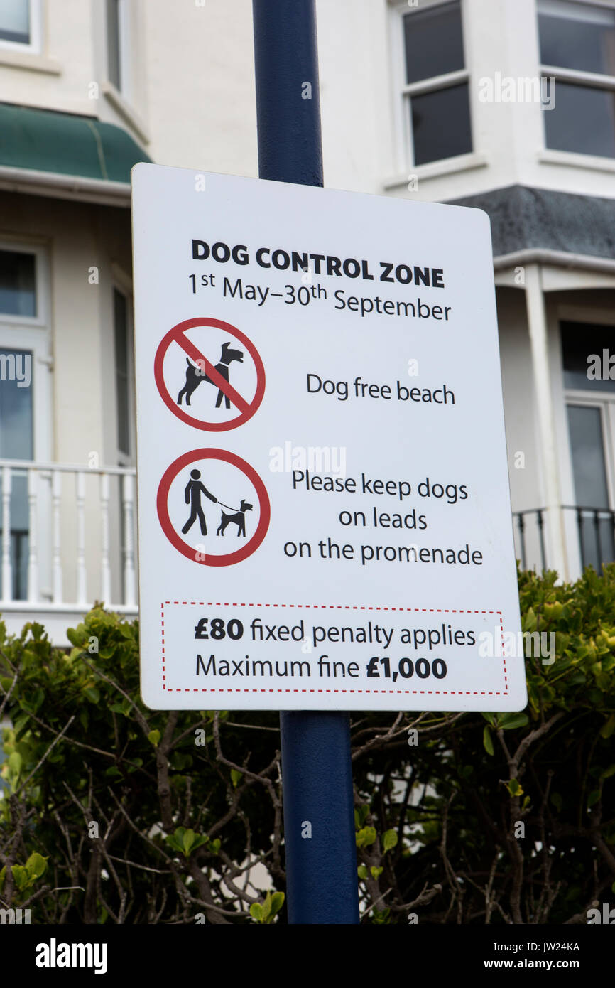 Dog control zone sign Stock Photo - Alamy