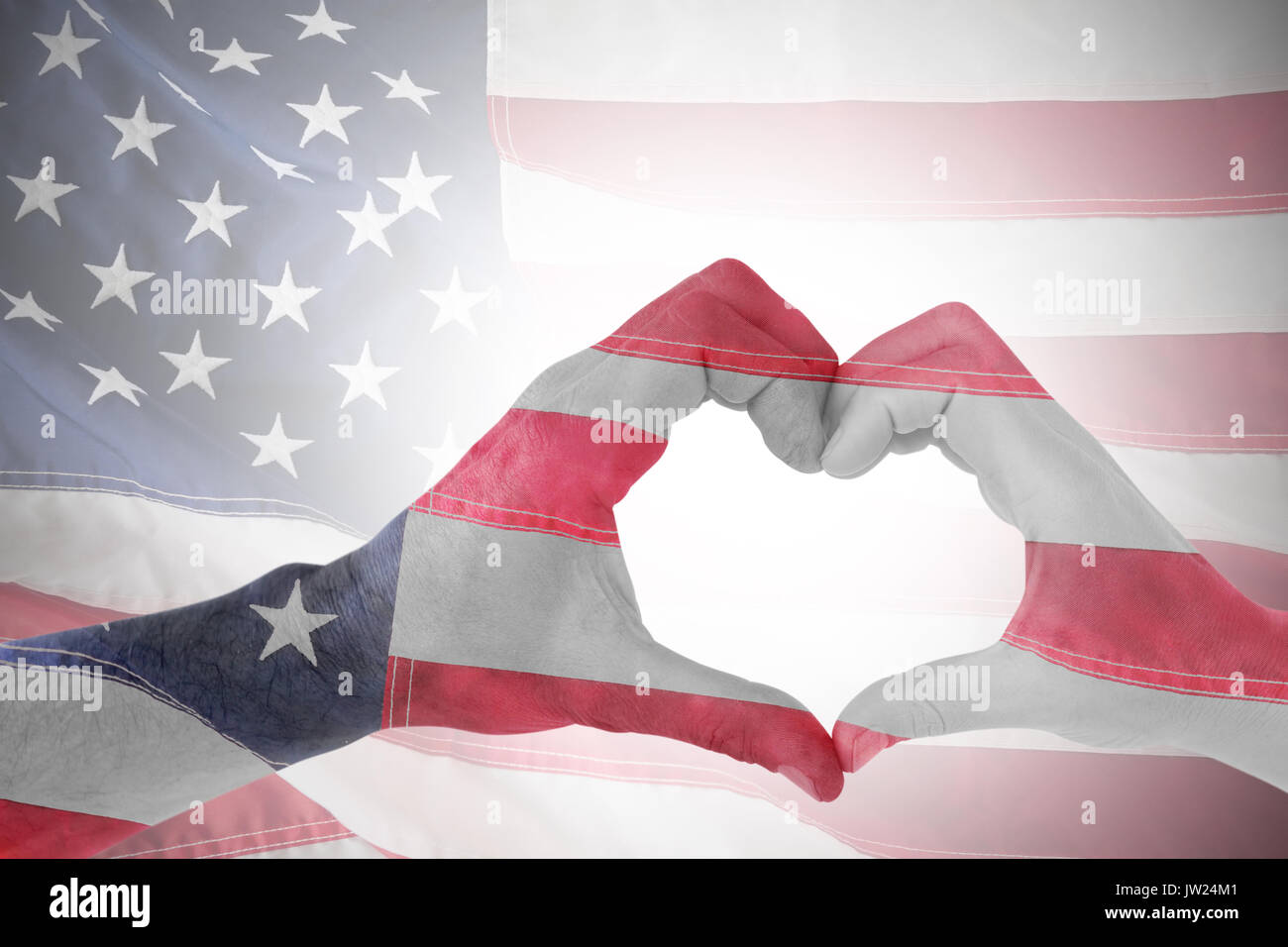 Couple making heart shape with hands against close-up of an flag Stock ...