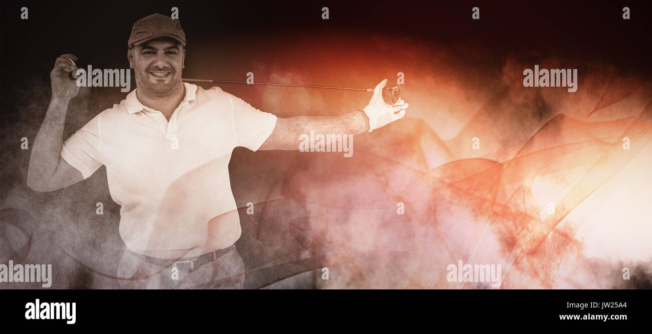 Portrait of golf player holding a golf club against splashing of blue ...