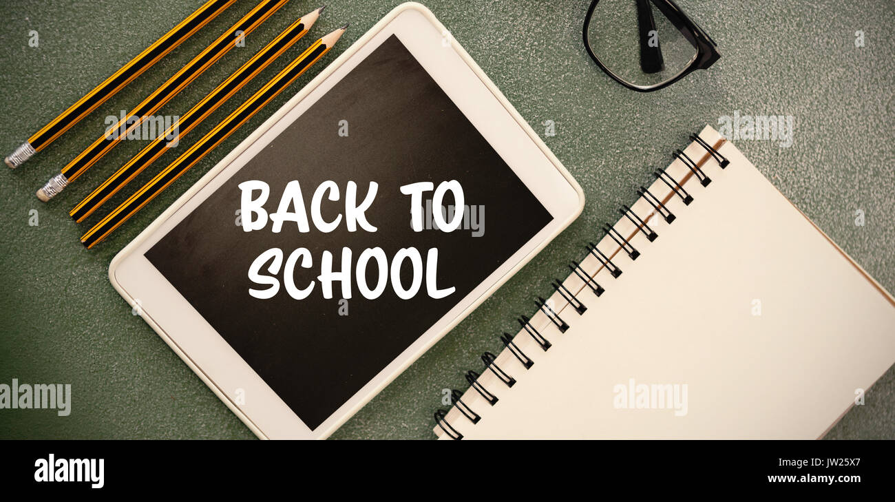 Back to school text on white background against tablet with diary and ...