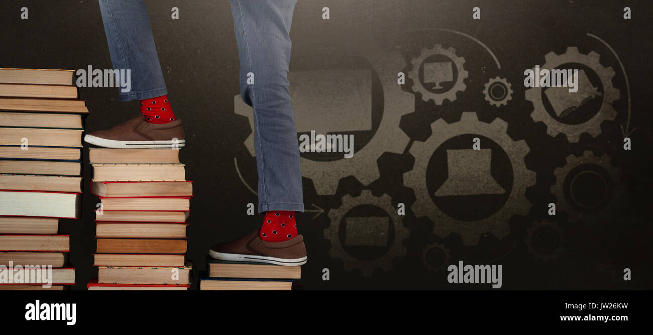 Boy climbing stack of books hi-res stock photography and images - Alamy