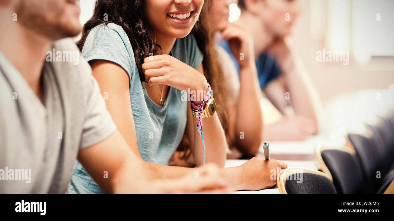 Smiling students listening lecturer in amphitheater Stock Photo - Alamy Smiling students listening lecturer in amphitheater Stock Photo - Alamy