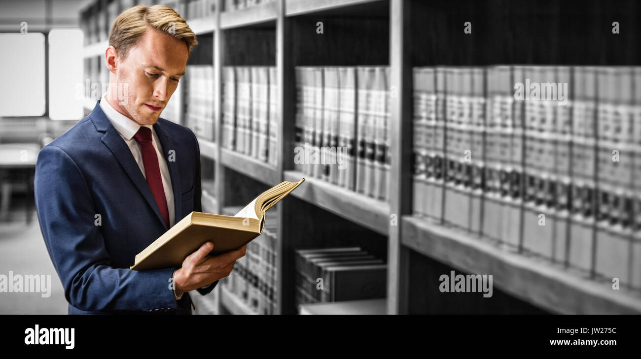 Handsome lawyer reading in law library at university Stock Photo - Alamy