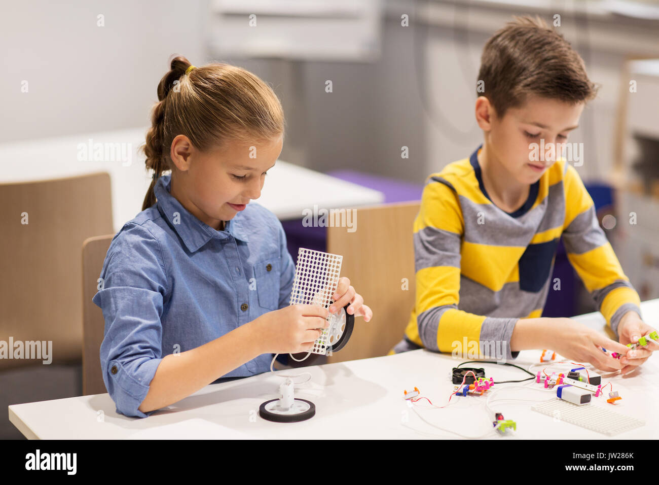 happy children building robots at robotics school Stock Photo - Alamy