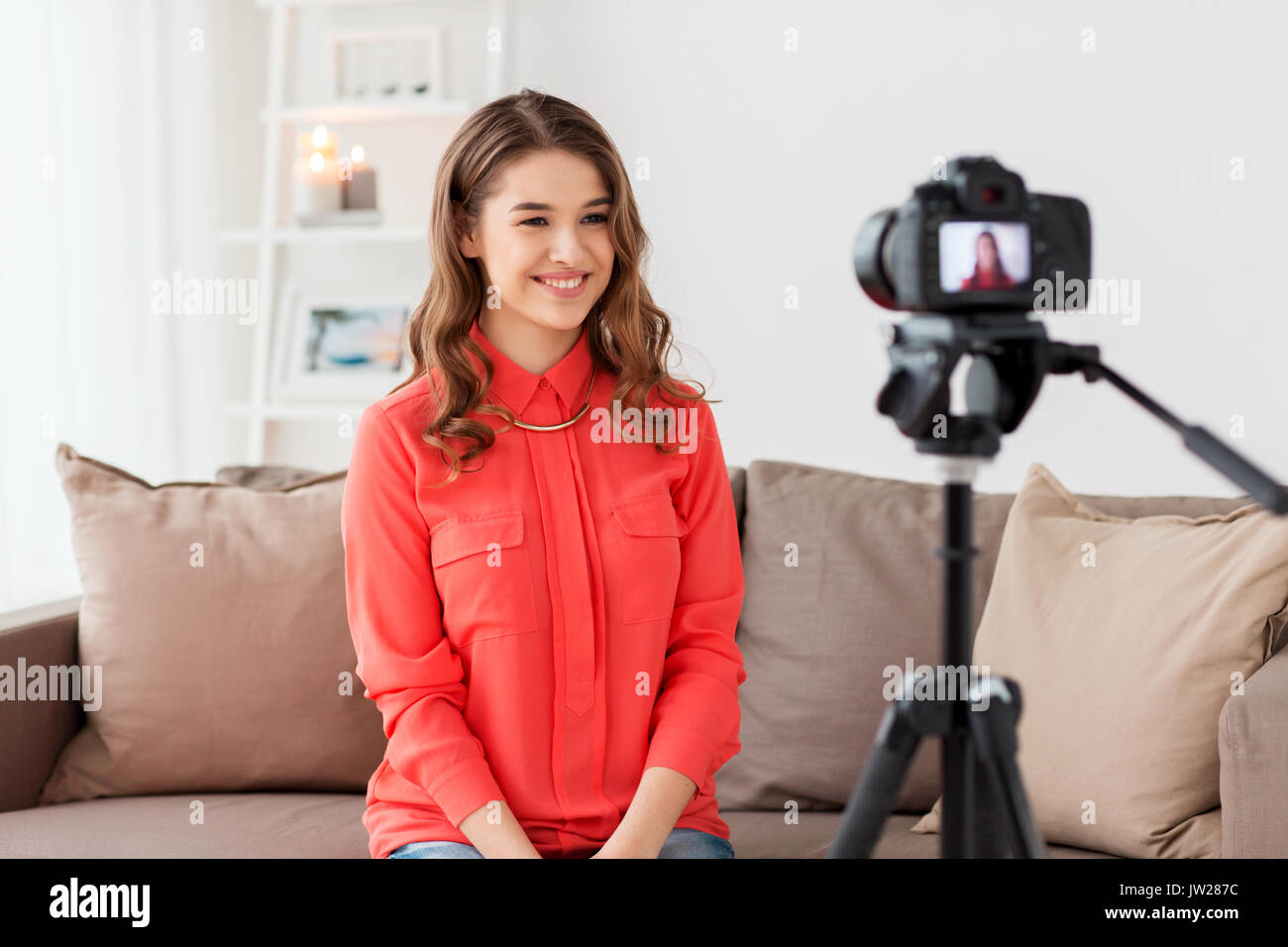 woman with camera recording video at home Stock Photo - Alamy