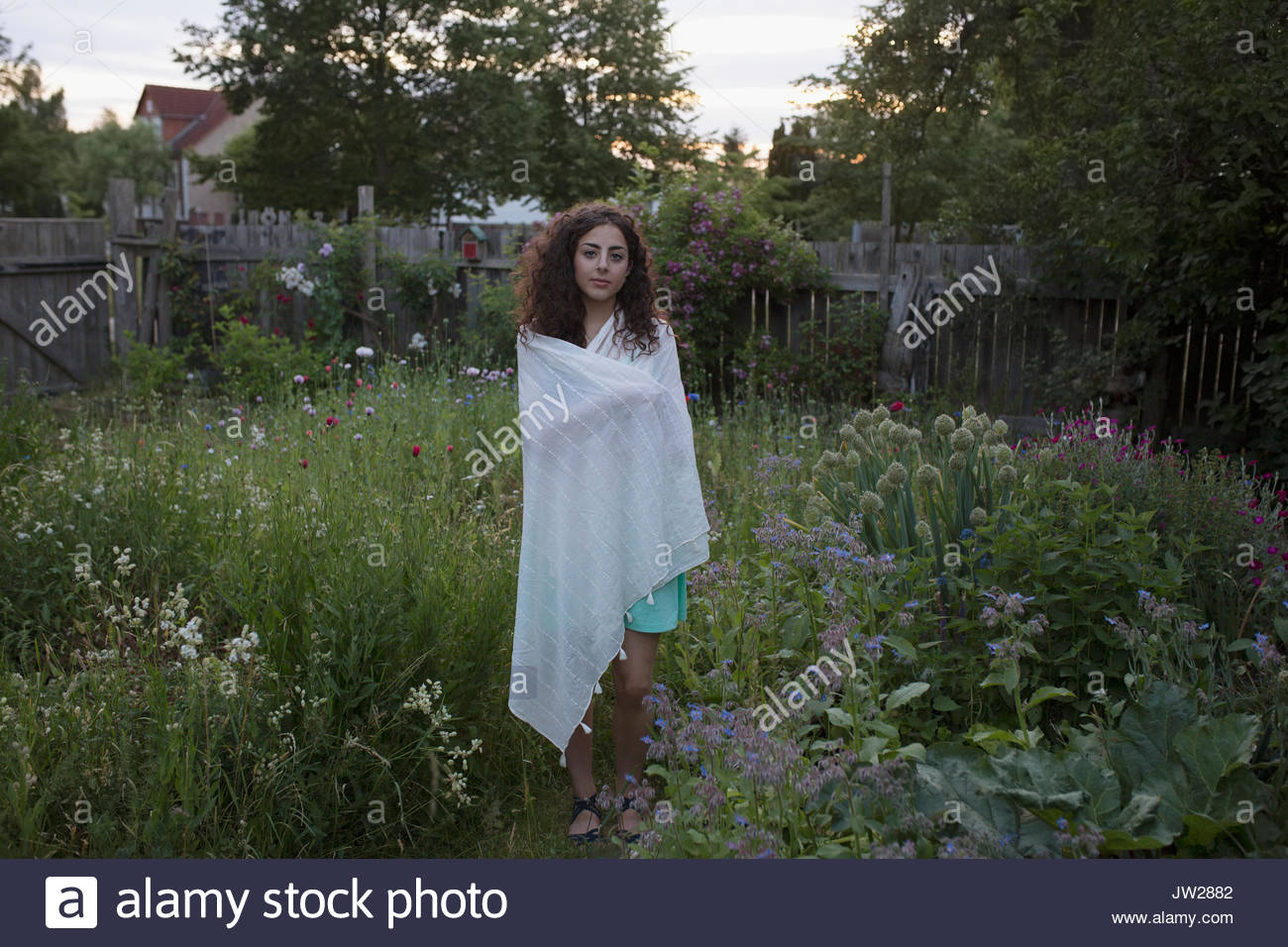 Serene young woman wrapped in shawl in idyllic hi-res stock photography ...