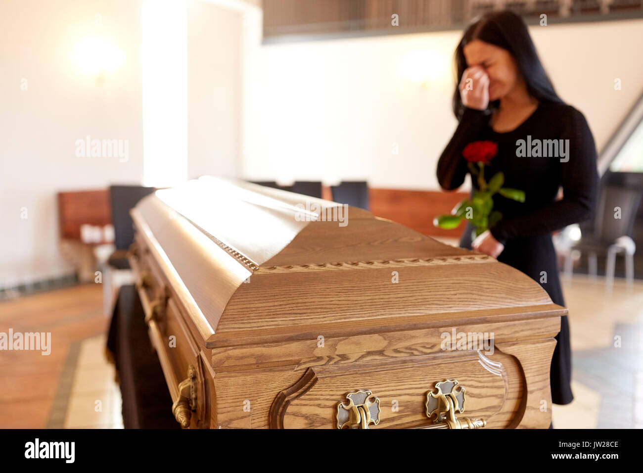 woman with coffin crying at funeral in church Stock Photo - Alamy
