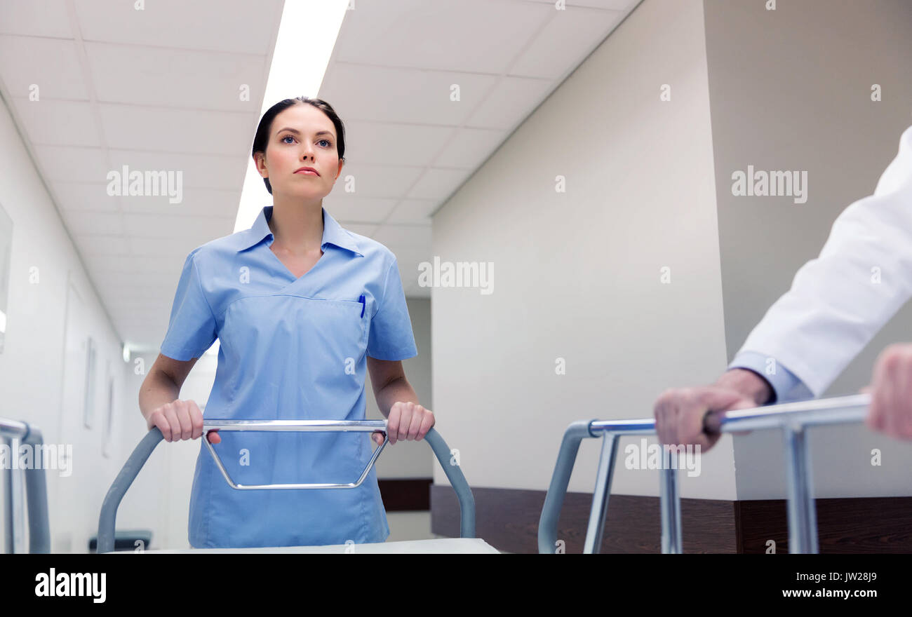 medic carrying hospital gurney at emergency Stock Photo - Alamy