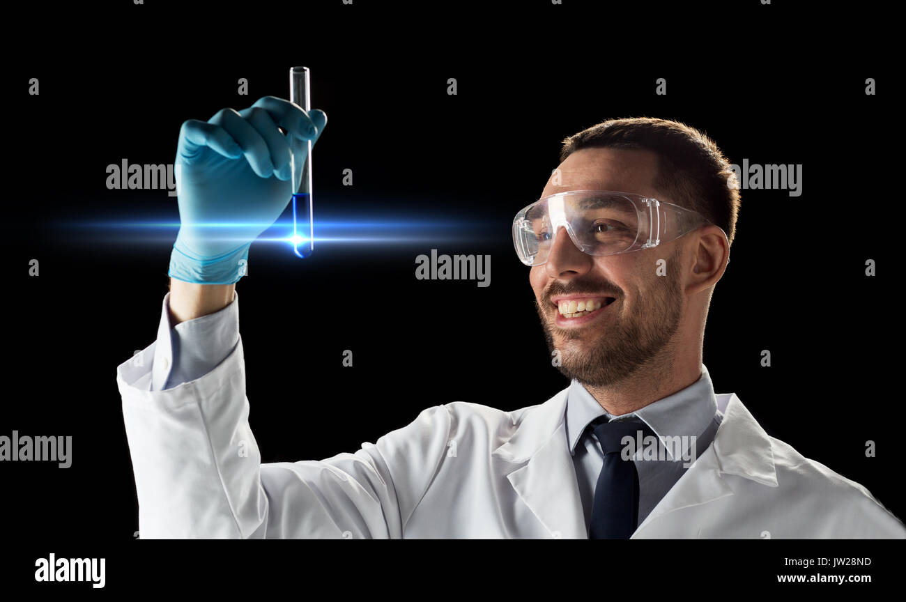 smiling scientist in goggles with test tube Stock Photo - Alamy