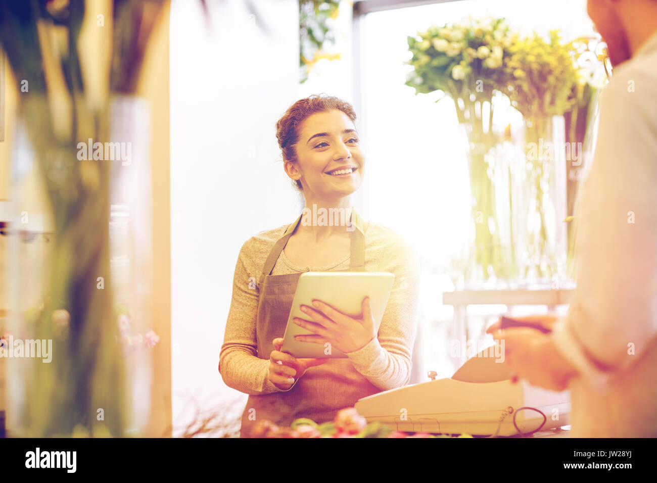 florist woman and man making order at flower shop Stock Photo - Alamy
