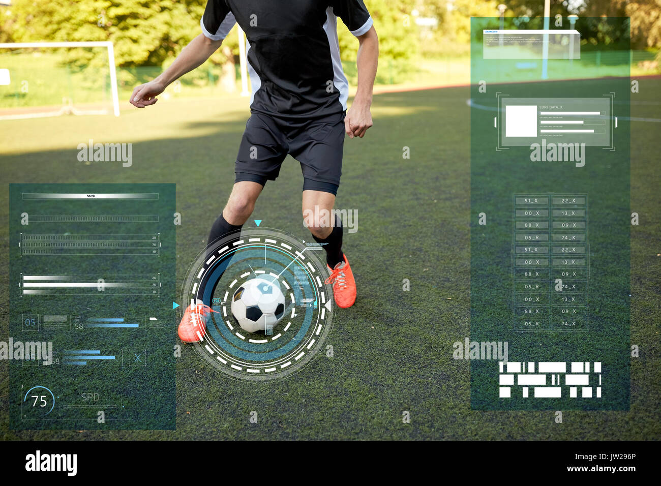 soccer player playing with ball on football field Stock Photo - Alamy