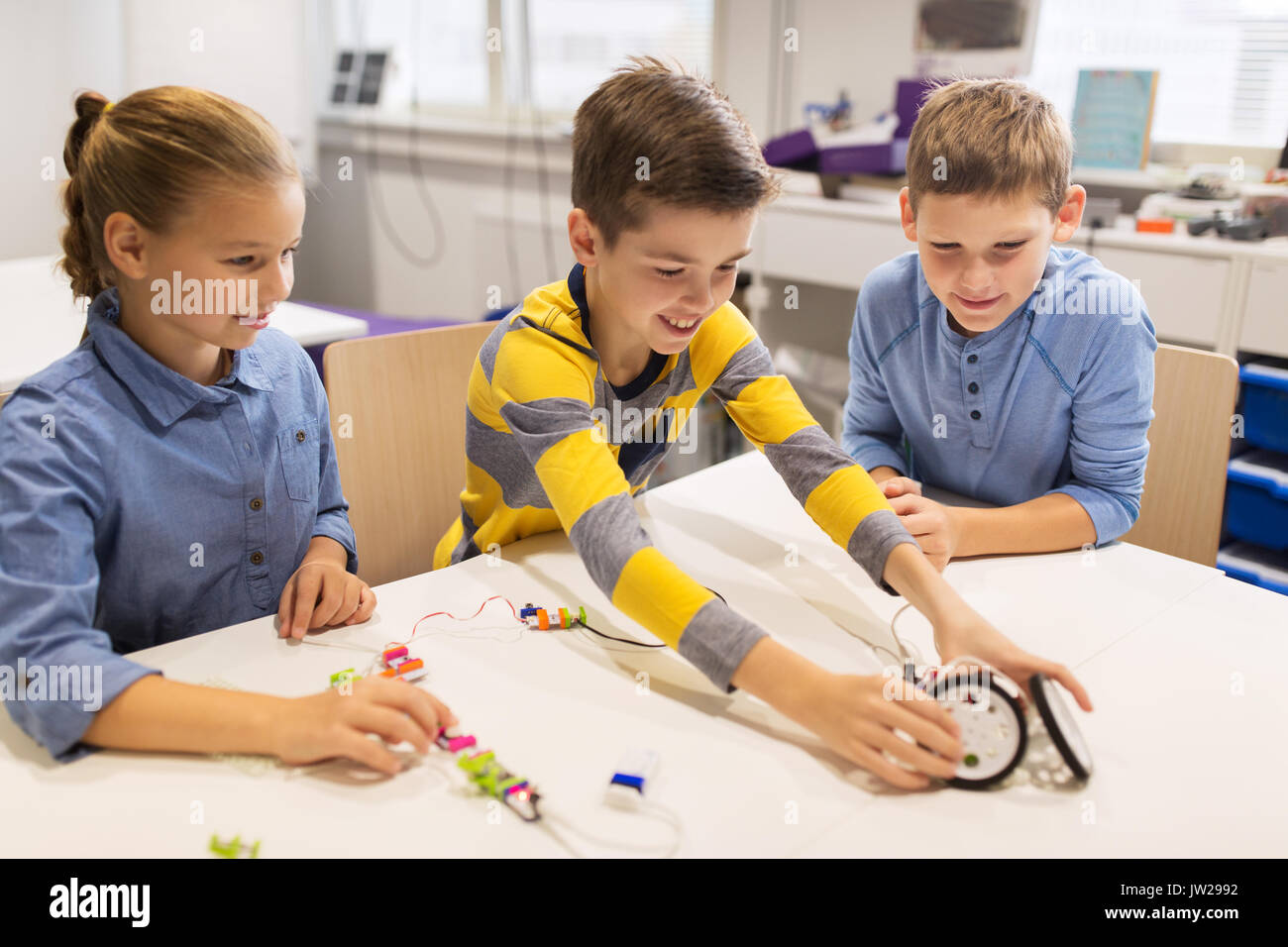 happy children building robots at robotics school Stock Photo - Alamy
