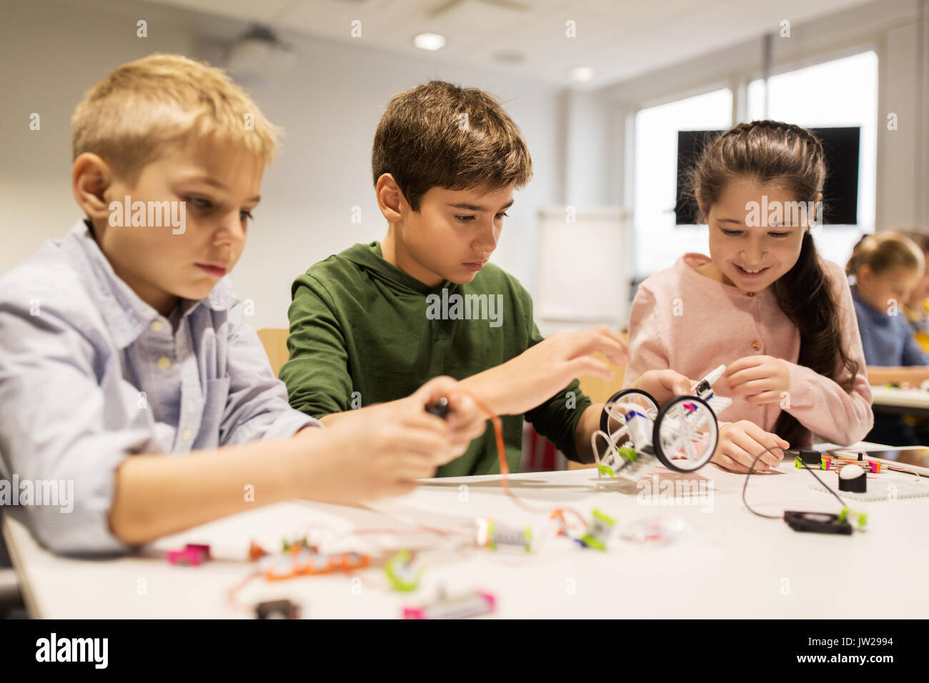 happy children building robots at robotics school Stock Photo - Alamy