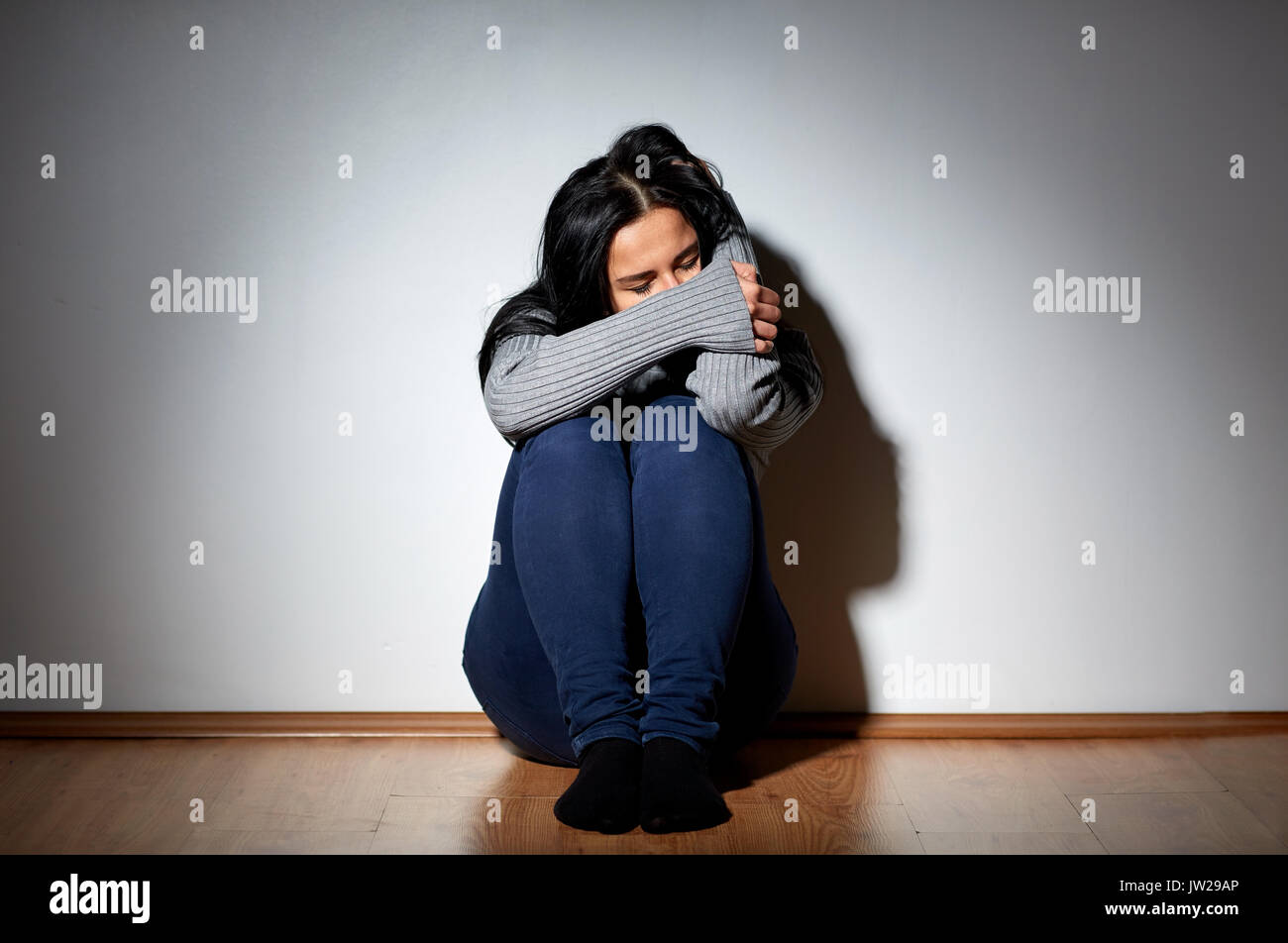 Abused woman crying home hi-res stock photography and images - Alamy