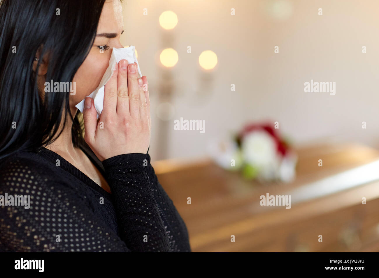 woman with coffin crying at funeral in church Stock Photo - Alamy