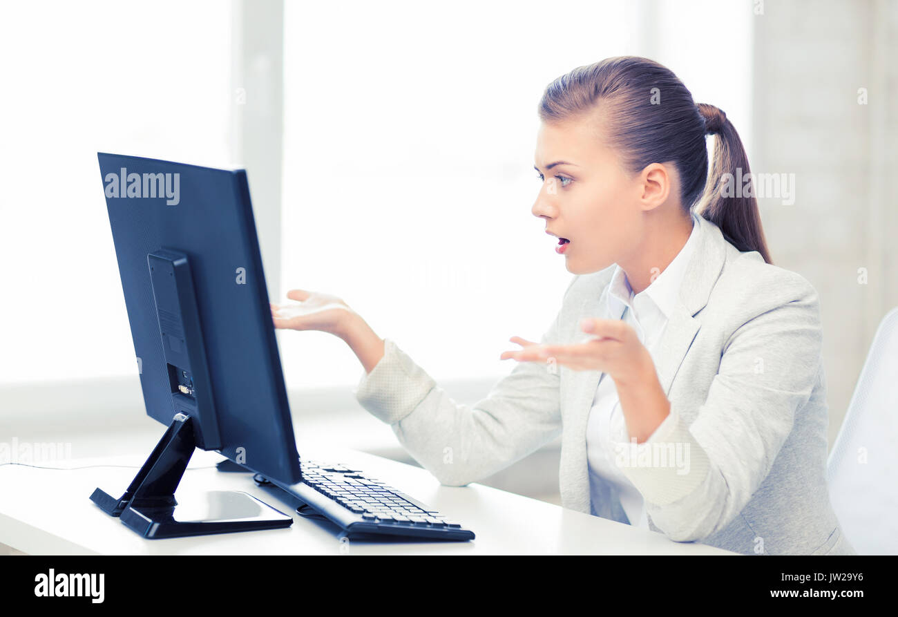 stressed student with computer in office Stock Photo - Alamy