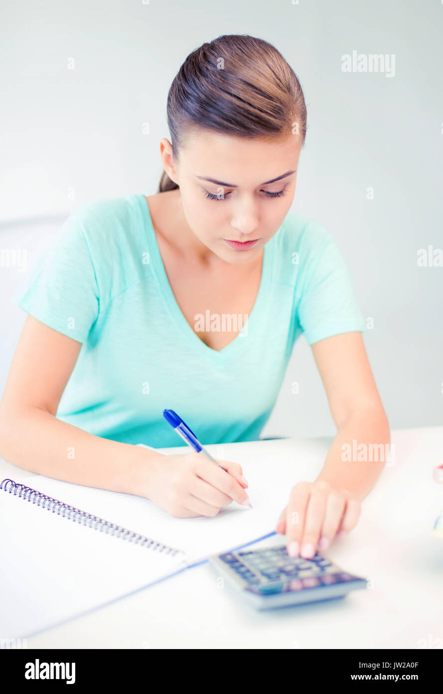 student girl with notebook and calculator Stock Photo - Alamy