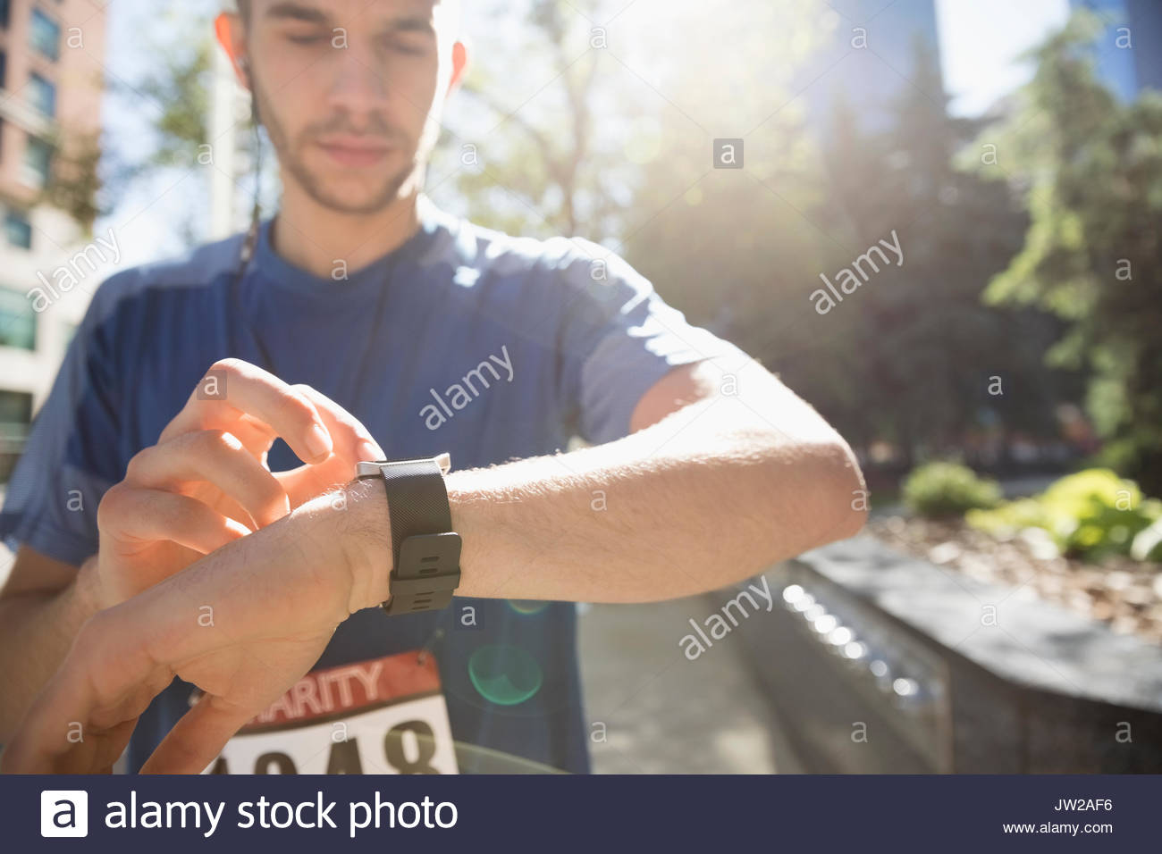 Man running watch park hi-res stock photography and images - Alamy