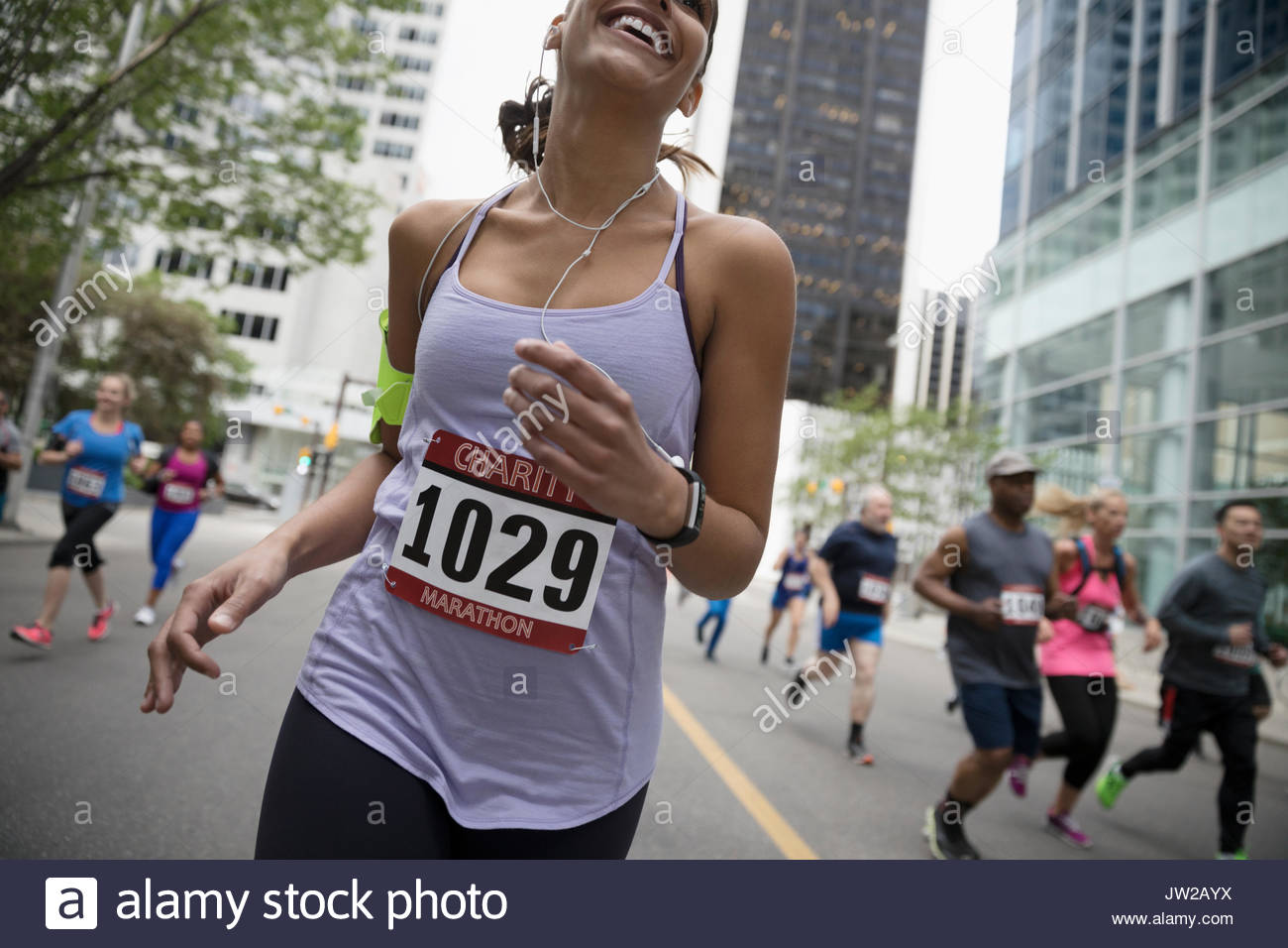 Female marathon runner wearing marathon bib hi-res stock photography ...