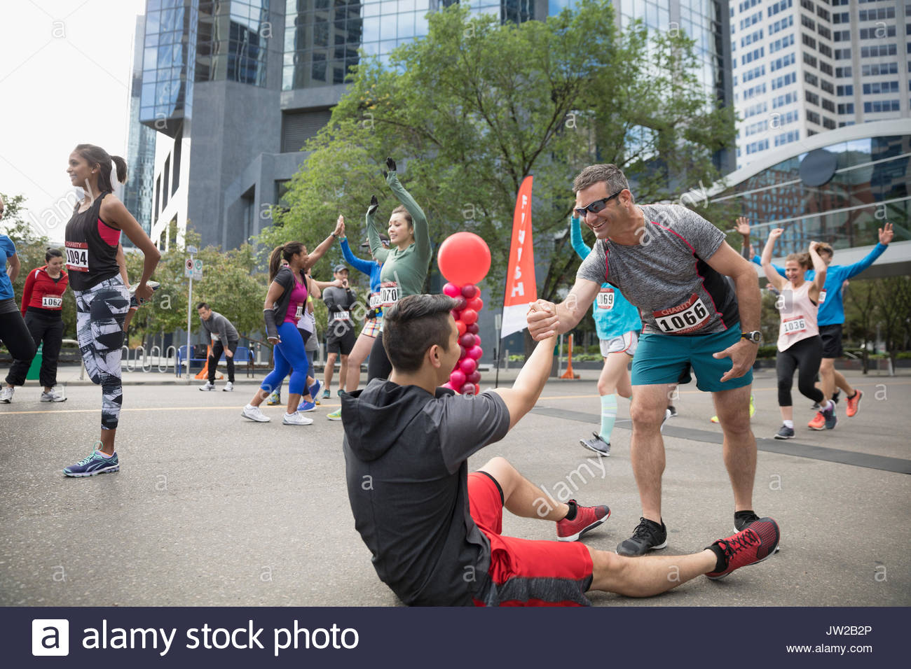 Helping person male hi-res stock photography and images - Alamy